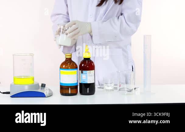 Scientist conducting iodine clock chemical reaction experiment in ...