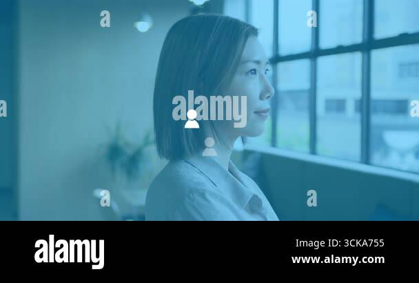 Executive sitting facing grid window, watching user-profile icon ...