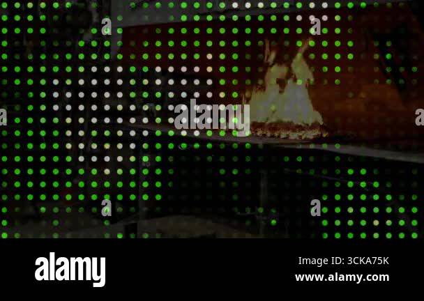 Industrial spark igniting fuel on workbench under vent hood flame ...