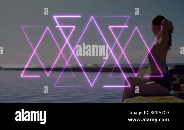 Neon triangles fading over lake initiating wellness overlay while woman ...