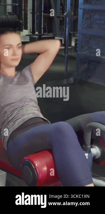 A focused young girl with long dark hair in a ponytail is intensely ...