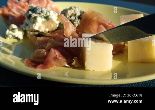 Process of dry-cured prosciutto leg slicing in luxury restaurant ...