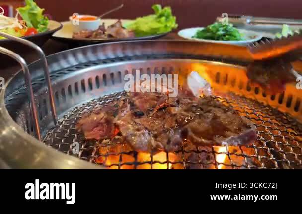 Grilled beef steak meat with salt and pepper. Beef steak grilled on a ...