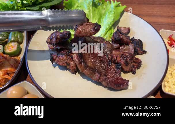 Grilled beef steak meat with salt and pepper. Beef steak grilled on a ...