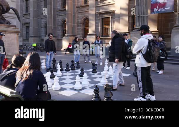 People playing and watching a giant chess game Stock Video Footage - Alamy