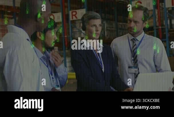 Warehouse team tapping headset and navigating laptop screen, optimizing ...