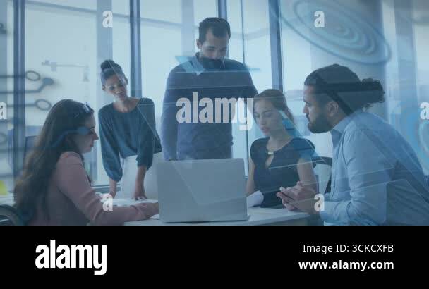Team reviewing business data on laptop as woman commenting and man ...