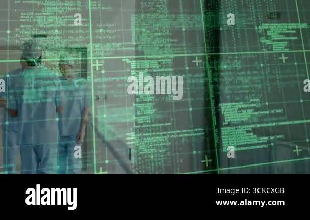 Doctor leading team walking corridor confirming patient tablet data ...