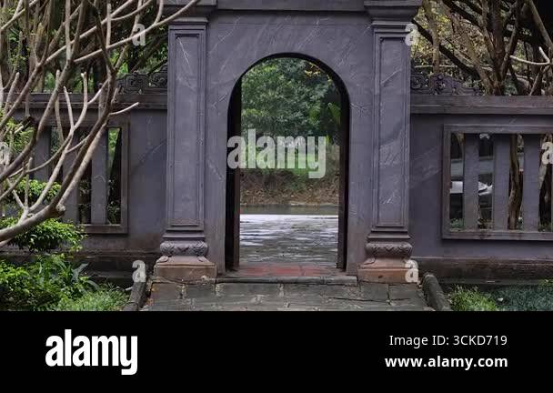 Stone gate surrounded by nature and trees Stock Video Footage - Alamy