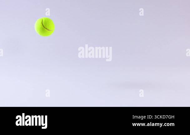 Tennis ball bouncing on a flat surface Stock Video Footage - Alamy