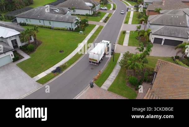 Garbage removal in residential area. Waste truck loading household ...