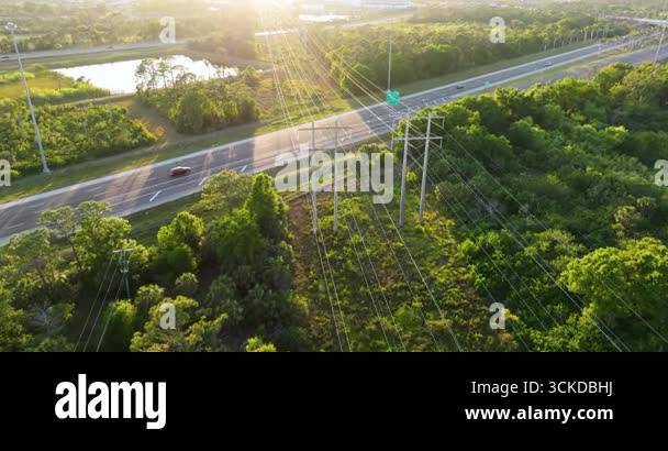 Electric power towers support high voltage cables crossing over active ...