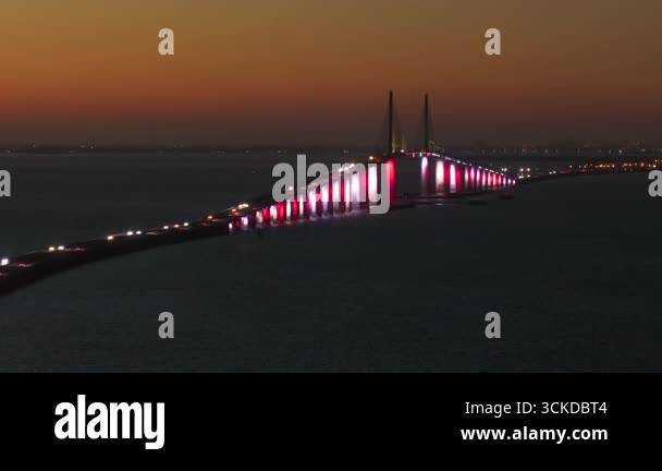Highway road traffic driving at night over Sunshine Skyway Bridge in ...