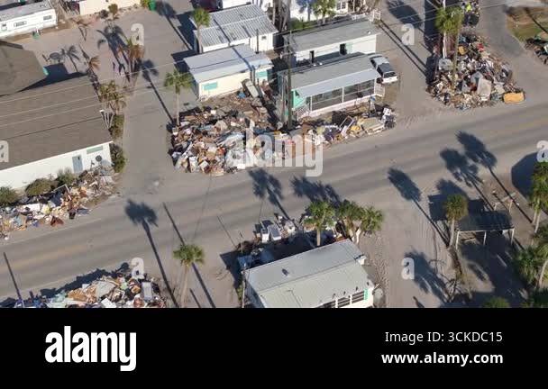 Rubbish and scrap disposed in heaps on street side after hurricane ...