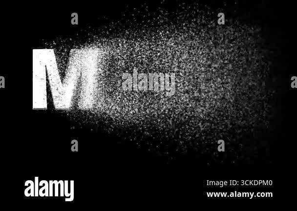 Disappearing English alphabet M into small particles on plain black ...