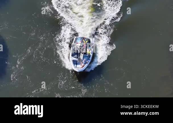 Drone captures a speedboat navigating through Gold Coast waters. Bright ...