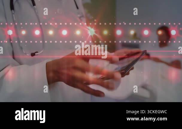 Healthcare professional tapping tablet, reviewing patient data and noting chart update beside ...