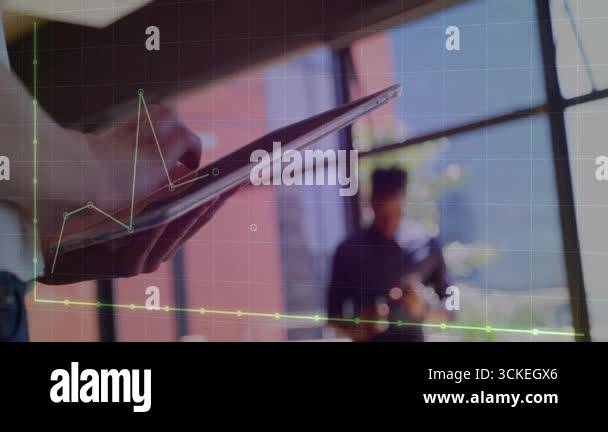 Tapping tablet touchscreen, hands tracking data trends on grid overlay ...