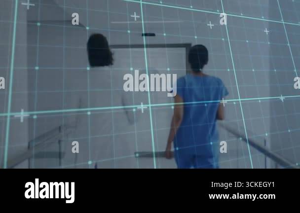 Doctor and nurse entering hospital corridor while digital grid ...