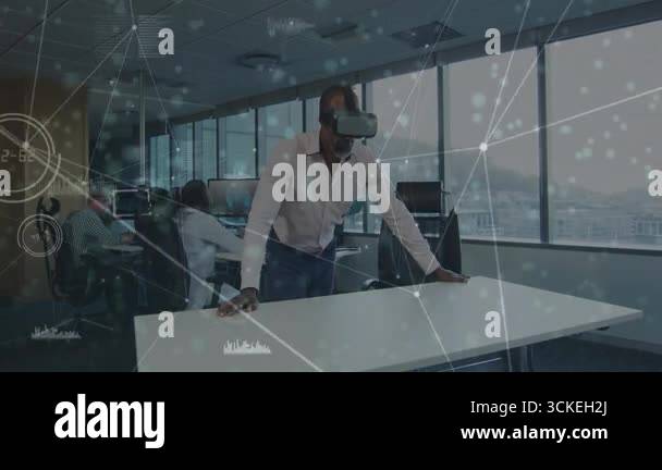 VR user leaning at table and scanning nodes as network overlay ...