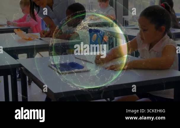 Teacher entering classroom and leaning over student desk guiding ...