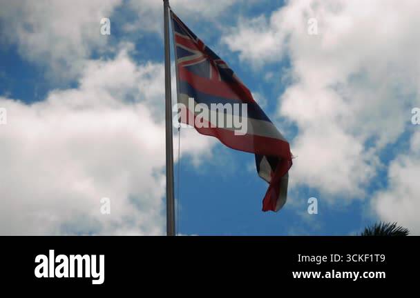 State flag of Hawaii waving proudly in the wind during sunny weather ...