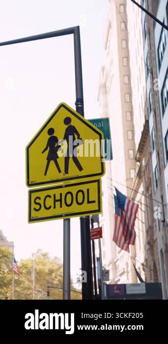 Bright school zone sign warns traffic about children crossing in the ...