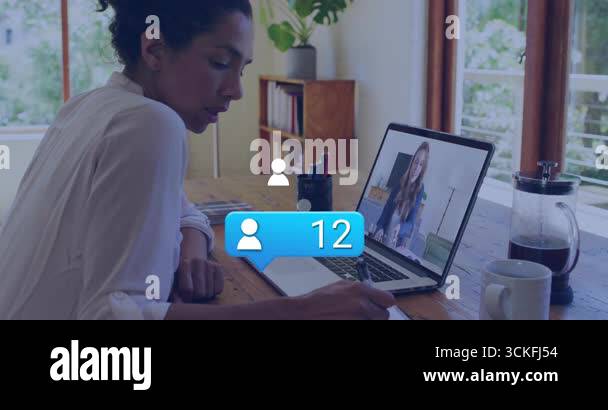 Businesswoman writing notes at desk, activating animated count rising ...