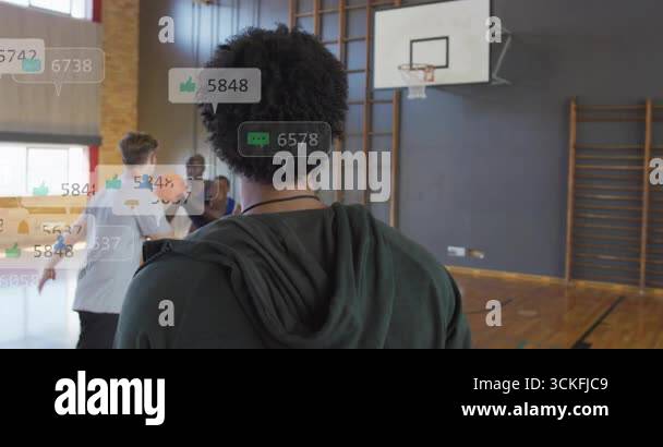 Coach observing basketball practice, pointing to guide next play after ...