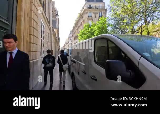 Two people walking past a parked van Stock Video Footage - Alamy