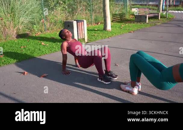 Female athletes synchronizing fitness training, supporting each other ...
