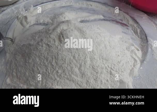 hand of farmer using basket to clean flour Stock Video Footage - Alamy