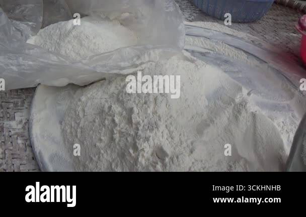 hand of farmer using basket to clean flour Stock Video Footage - Alamy