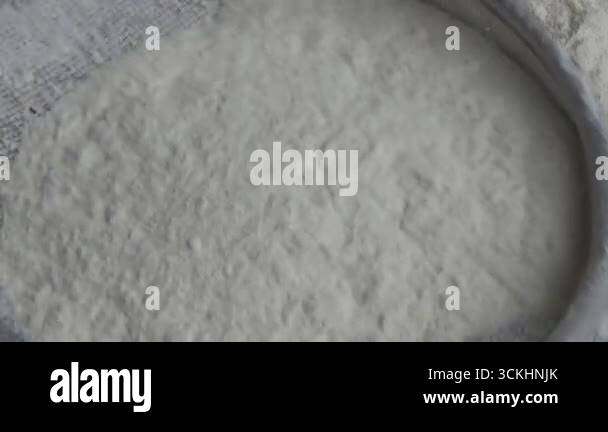 hand of farmer using basket to clean flour Stock Video Footage - Alamy