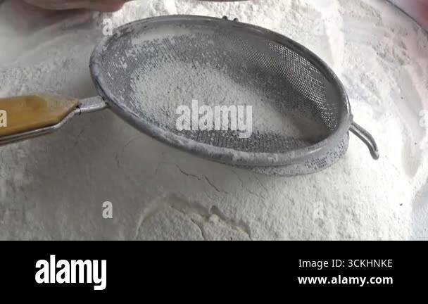 hand of farmer using basket to clean flour Stock Video Footage - Alamy