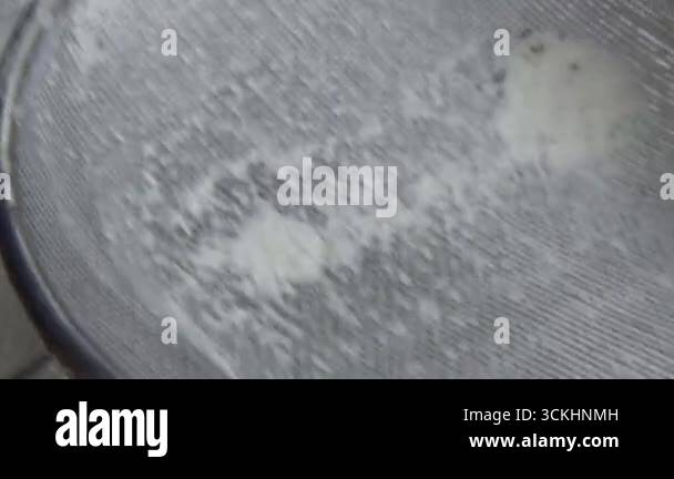 hand of farmer using basket to clean flour Stock Video Footage - Alamy