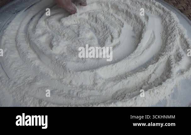 hand of farmer using basket to clean flour Stock Video Footage - Alamy