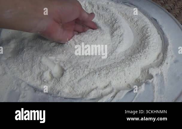 hand of farmer using basket to clean flour Stock Video Footage - Alamy