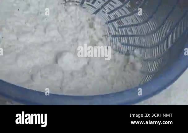 hand of farmer using basket to clean flour Stock Video Footage - Alamy