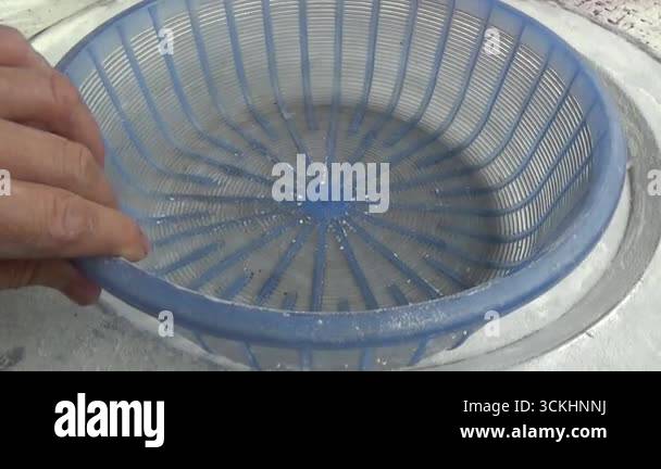 hand of farmer using basket to clean flour Stock Video Footage - Alamy
