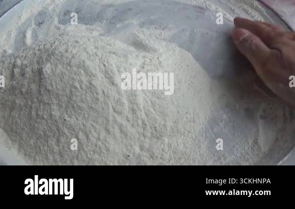 hand of farmer using basket to clean flour Stock Video Footage - Alamy