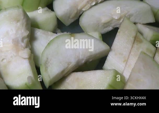 the gourd on tree. The chef used a knife to cut the squash to cook the ...