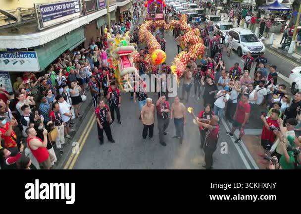 George Town, Penang, Malaysia - Feb 24 2024: People line the street to ...