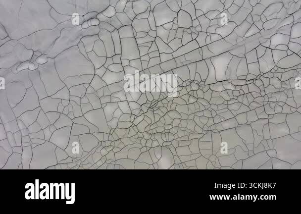Aerial view of gray abstract mud patterns and cracks on acid mine ...
