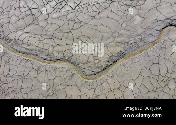 Aerial view of gray abstract mud patterns and cracks on acid mine ...