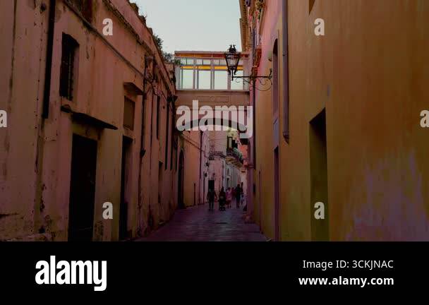 Atmospheric evening footage of a traditional alley in Nards historic ...