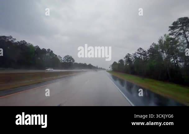 Driving car on the highway under heavy rain. POV view from the front ...