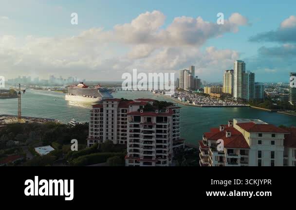 The large cruise liner slowly departing from the Miami port with ...