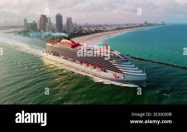 The large cruise liner slowly departing from the Miami harbor with the ...