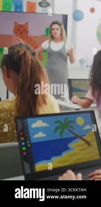 Female Teacher Guiding Young Kids During Art Lesson Using Digital ...
